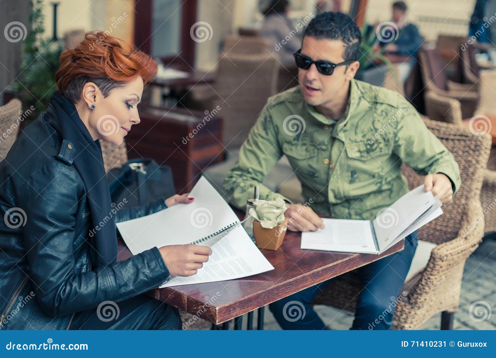 Couple looking at the menu stock image. Image of choice - 71410231