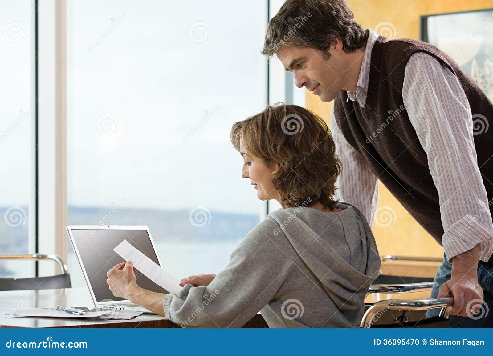 A Couple Looking at Paperwork Stock Photo - Image of building, boomers ...