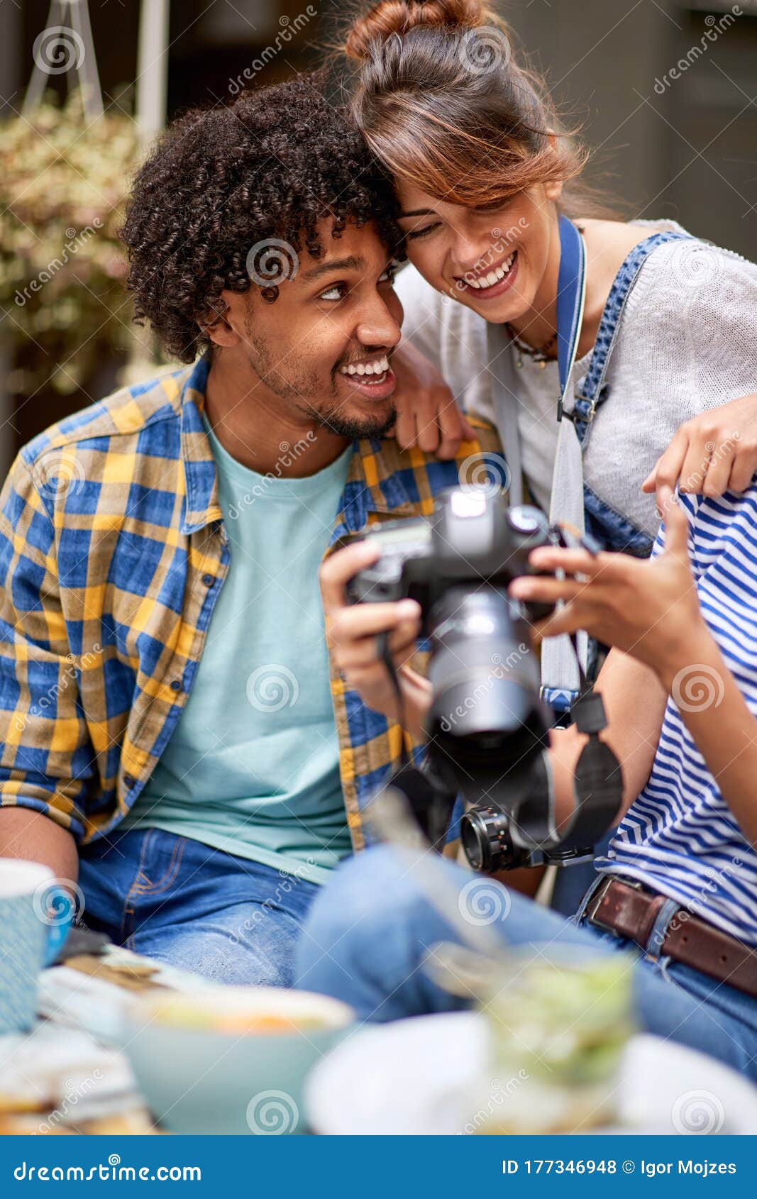 Couple Looking Photo in Camera Stock Photo - Image of multiethnic ...