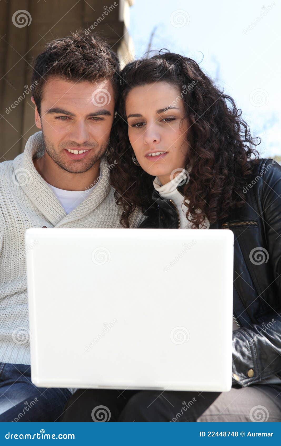 Couple Looking at Their Laptop Stock Photo - Image of interest ...