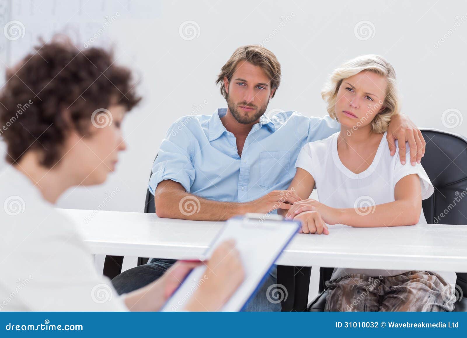 Couple Looking Thoughtful during a Session Stock Photo - Image of ...