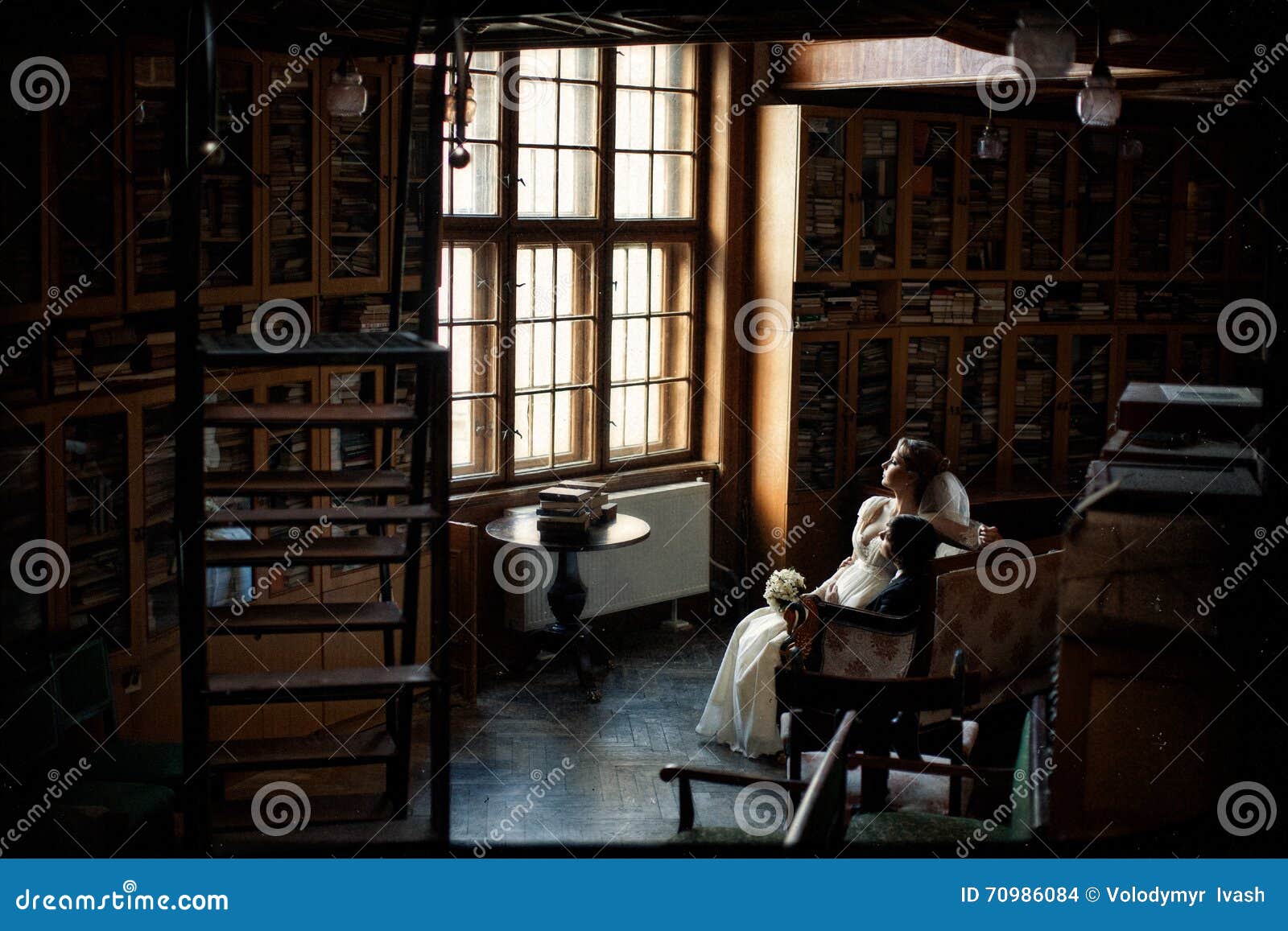 Couple Looks Out the Window in the Old Library Stock Photo - Image of ...