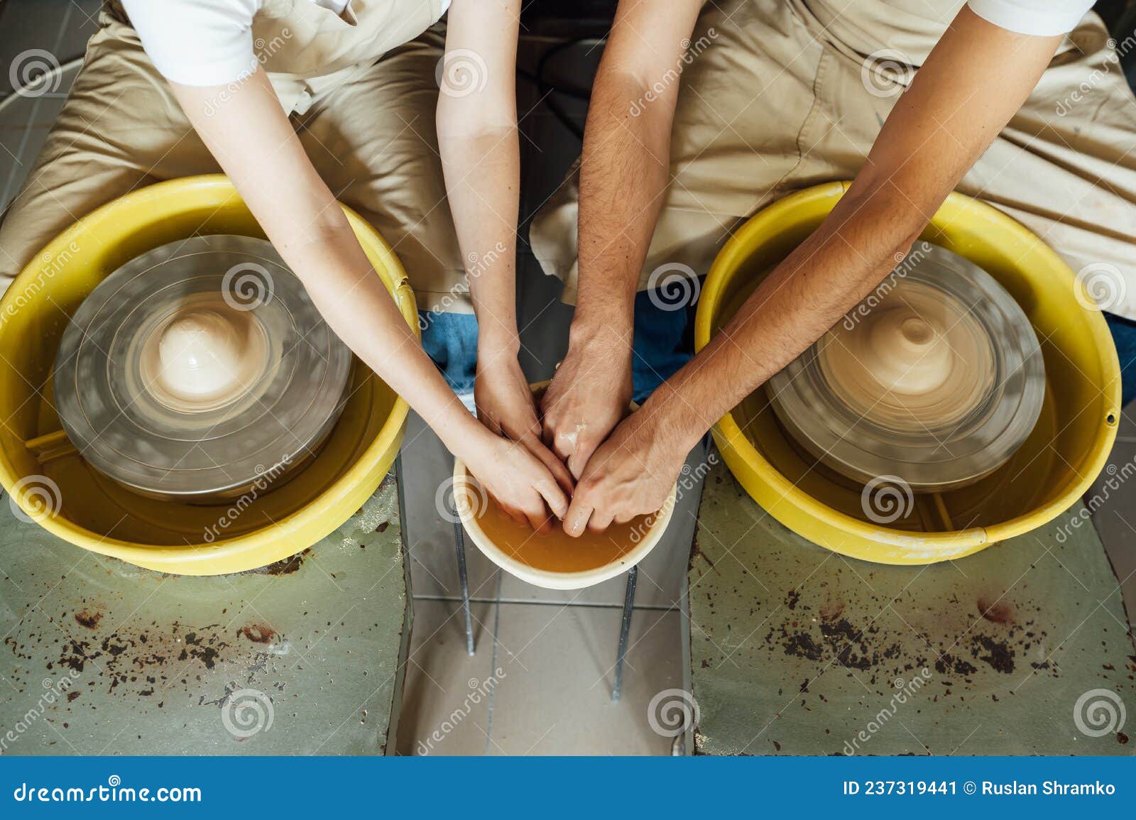 A Couple in Love Creates a Joint Cup in a Pottery Workshop. Potter ...