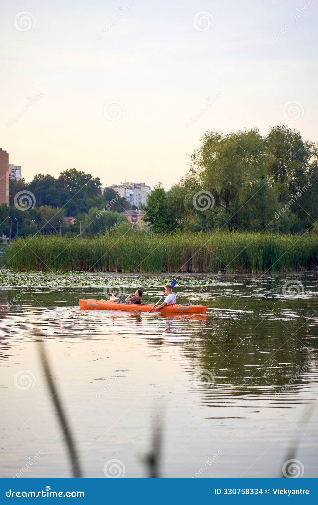 The Couple in Love Kayaking on the River at Sunset Stock Photo - Image ...