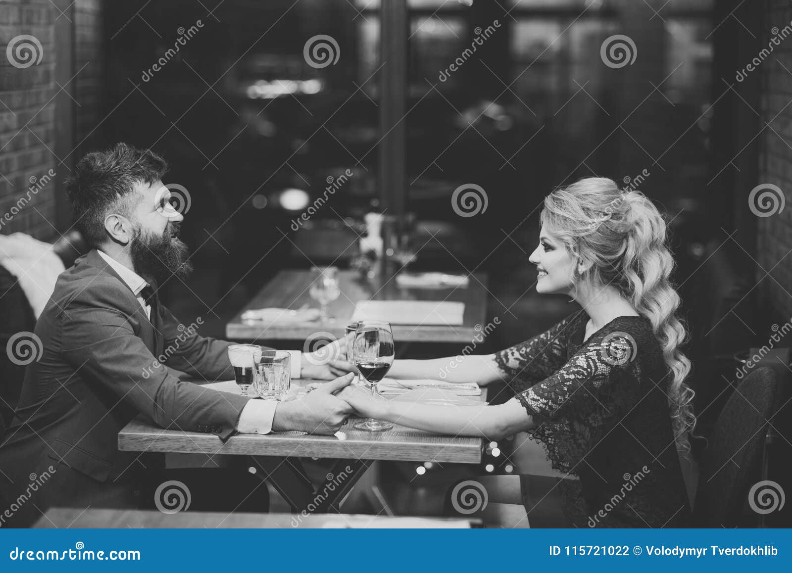 Couple in Love. Romantic Couple Dating in Pub at Night. Stock Photo ...