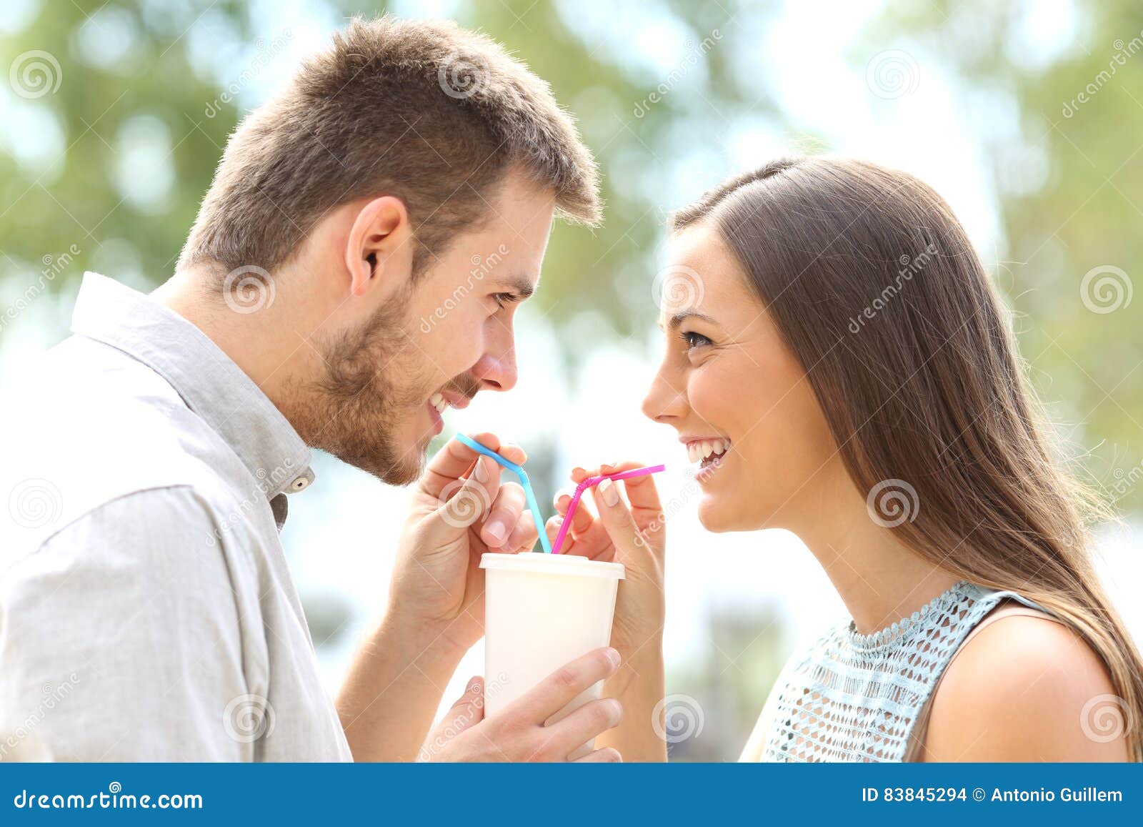 Couple in Love Sharing a Drink Stock Photo - Image of eating, hands ...