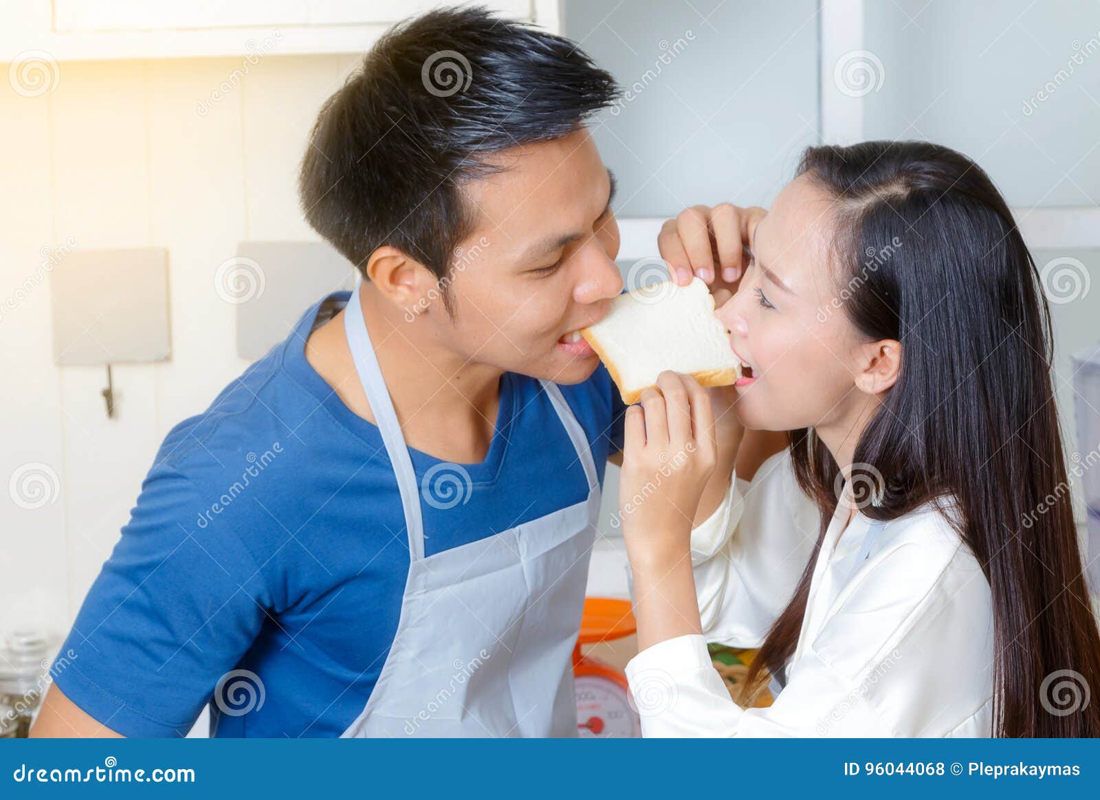 Couple in Love Sharing a Slice of Bread Stock Photo - Image of people ...