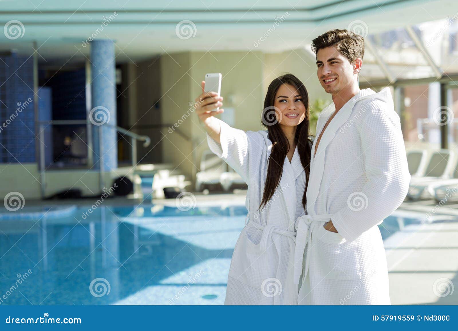 Couple in Love Standing Next To a Pool in a Robe Stock Image - Image of ...