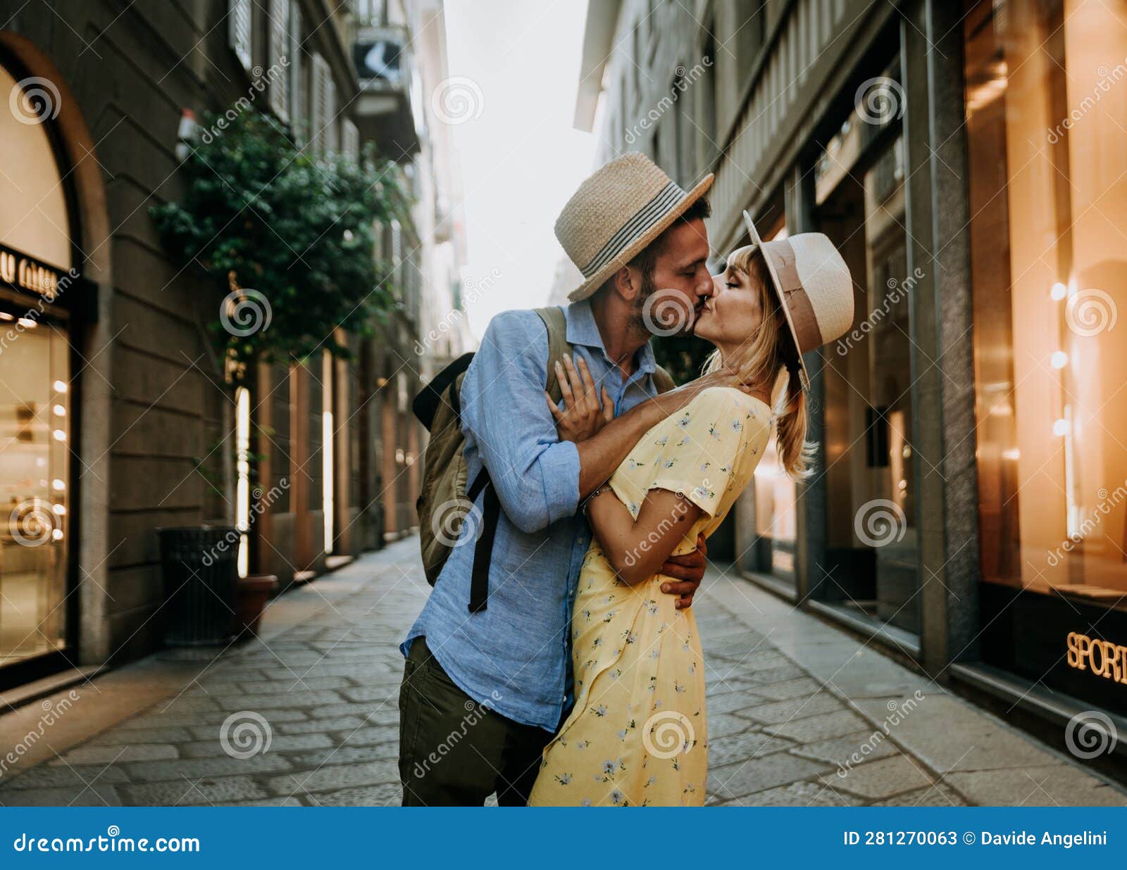 Couple Of Lovers Kissing On City Street Two Tourists Enjoying