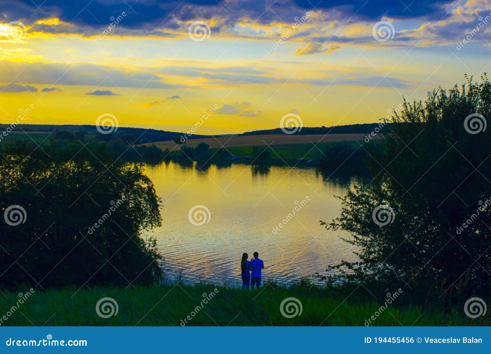 A Couple of Lovers on the Lake at Sunset Editorial Photo - Image of ...