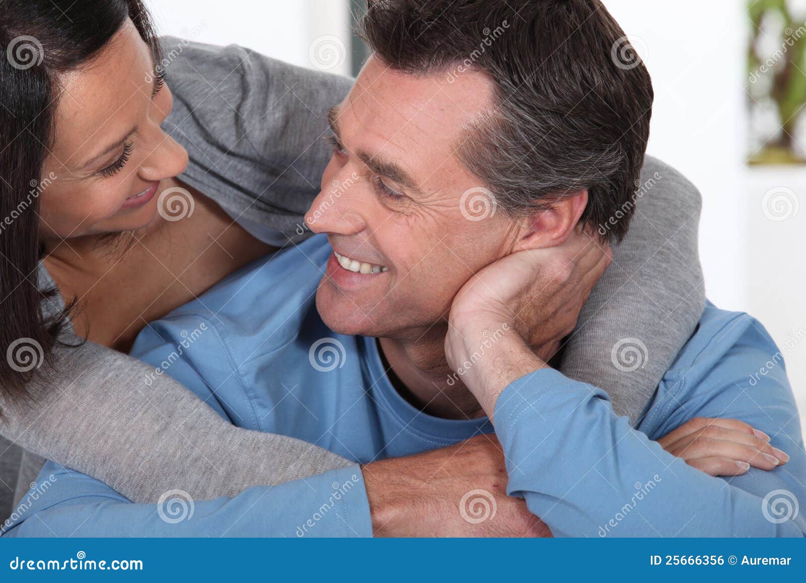 Couple in a loving embrace stock photo. Image of friends - 25666356