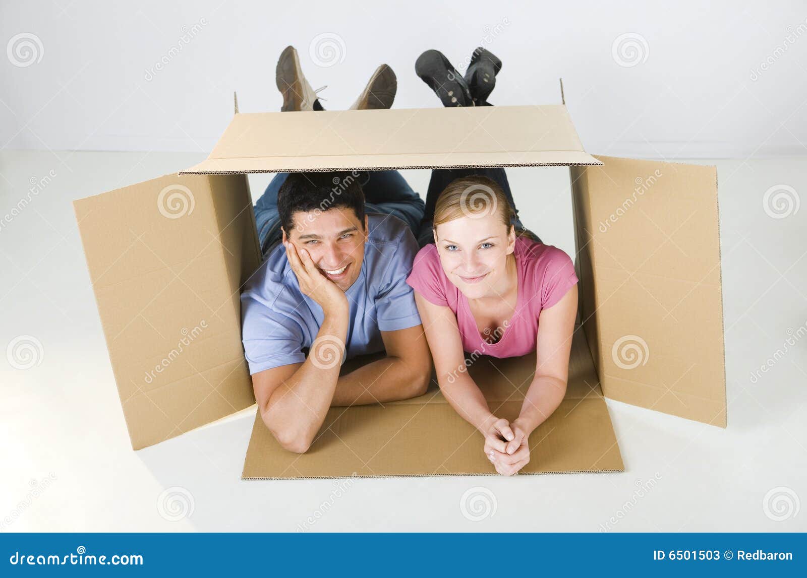 Couple lying in box stock image. Image of girlfriend, house - 6501503