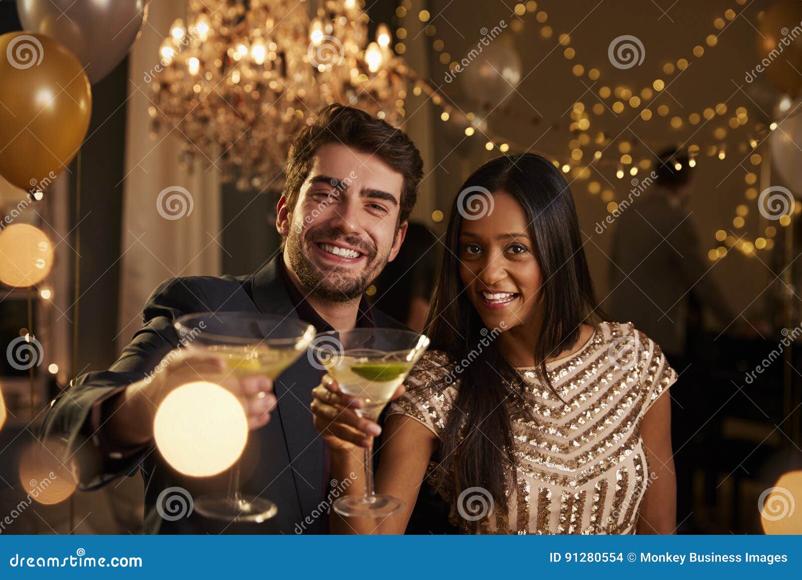 Couple Make Toast at Camera As they Celebrate at Party Stock Photo ...