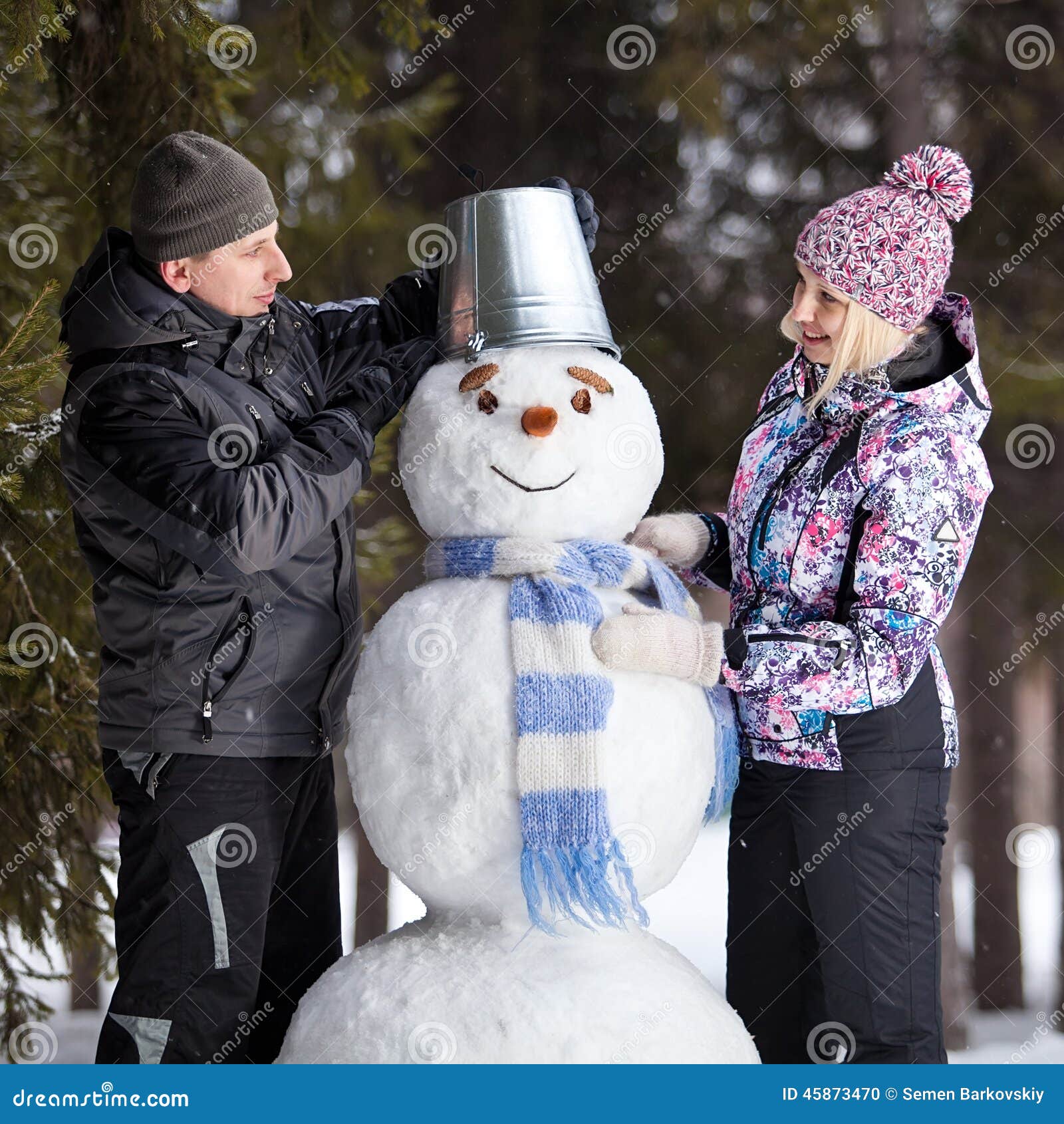 Couple makes snowman stock photo. Image of frost, male - 45873470