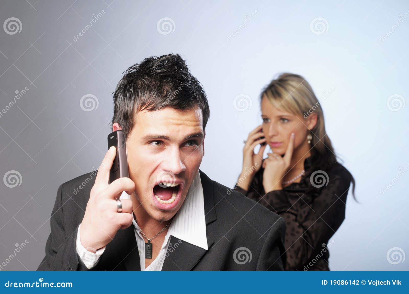 Couple making calls stock photo. Image of girl, clothes - 19086142