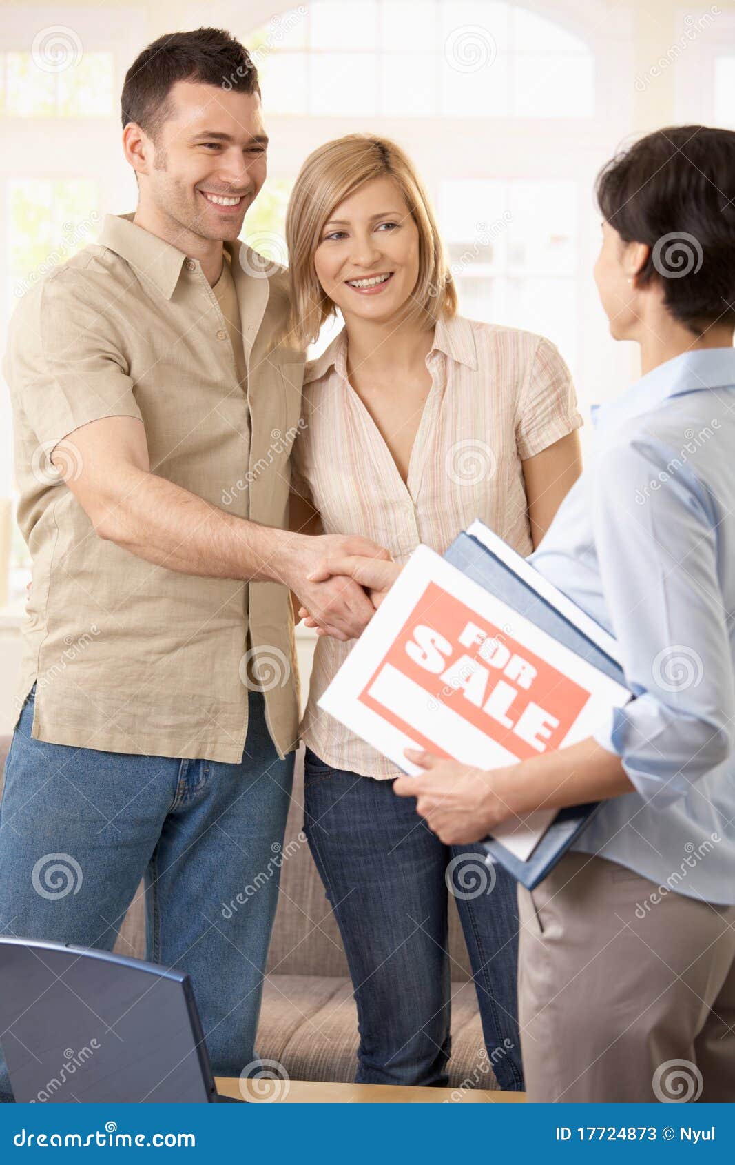 Couple Making Deal with Estate Agent Stock Image - Image of couple ...