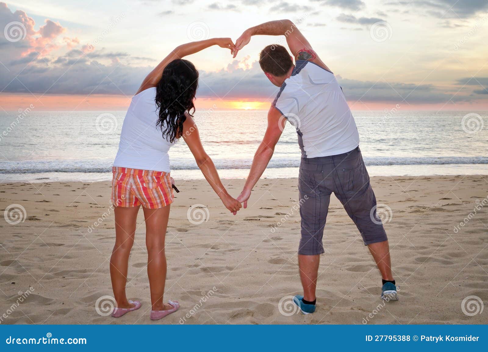 Couple Making Heart Shape with Arms at Sunset Stock Photo - Image of ...