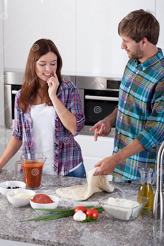 Couple during making pizza stock photo. Image of meal - 45184938