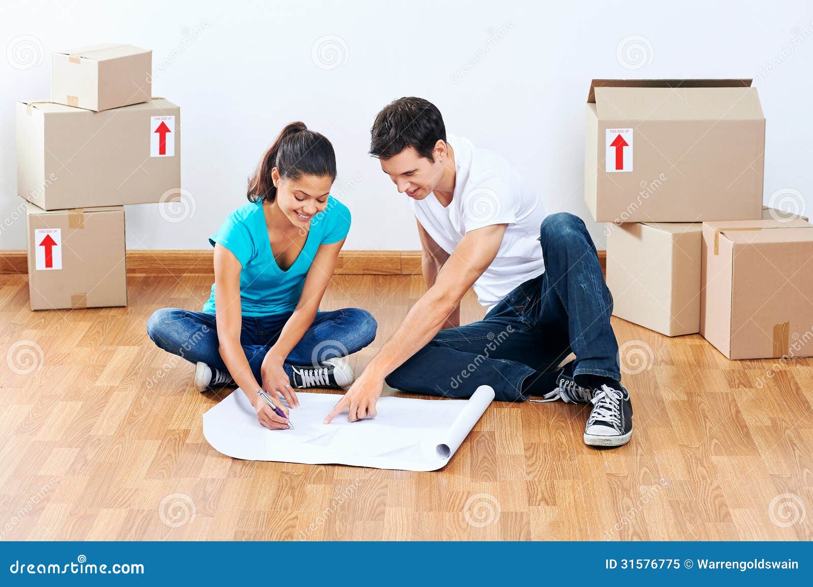 Couple making plans stock image. Image of cardboard, husband - 31576775