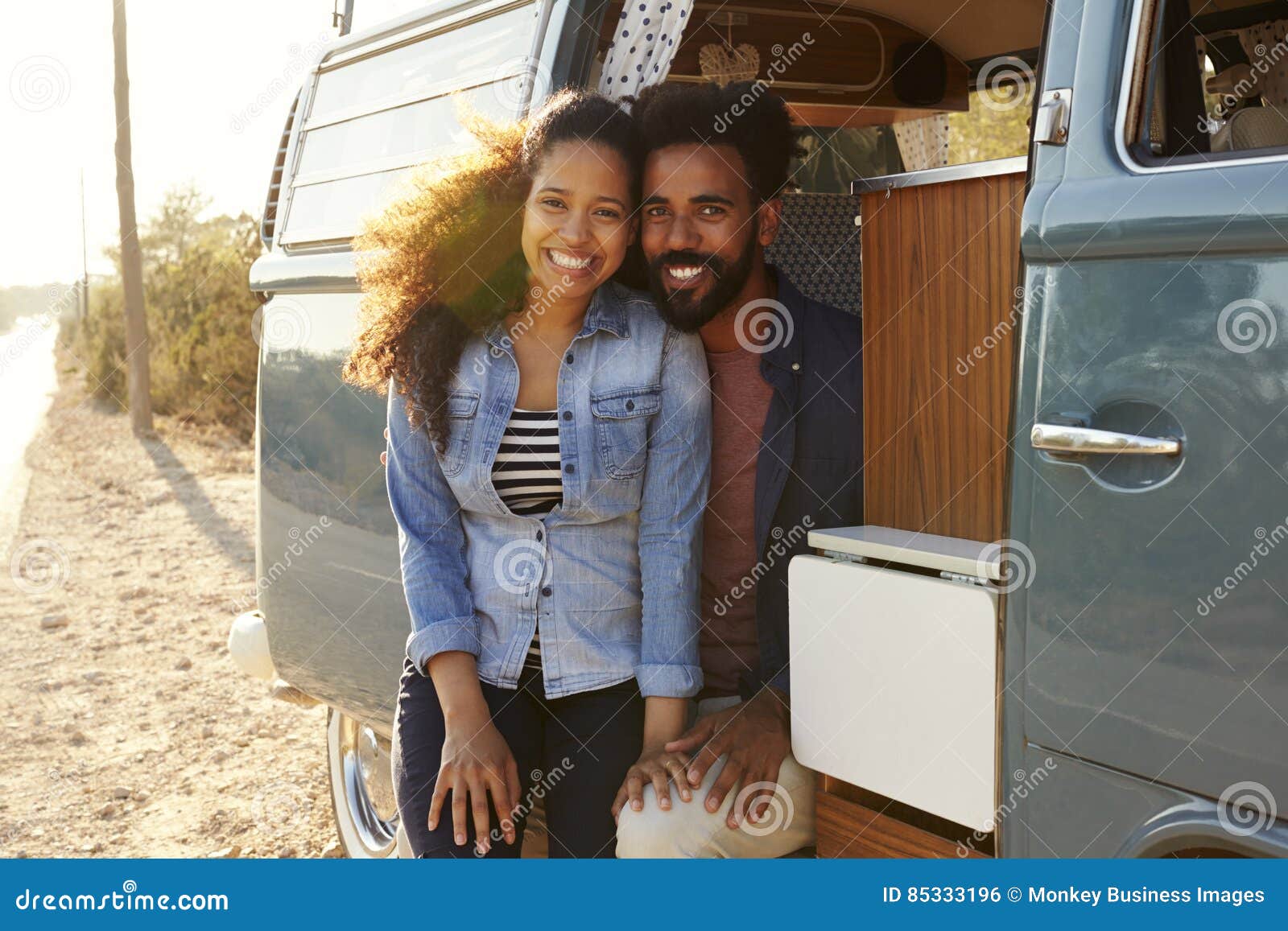 Couple Making a Roadside Stop in Their Van Look To Camera Stock Photo ...