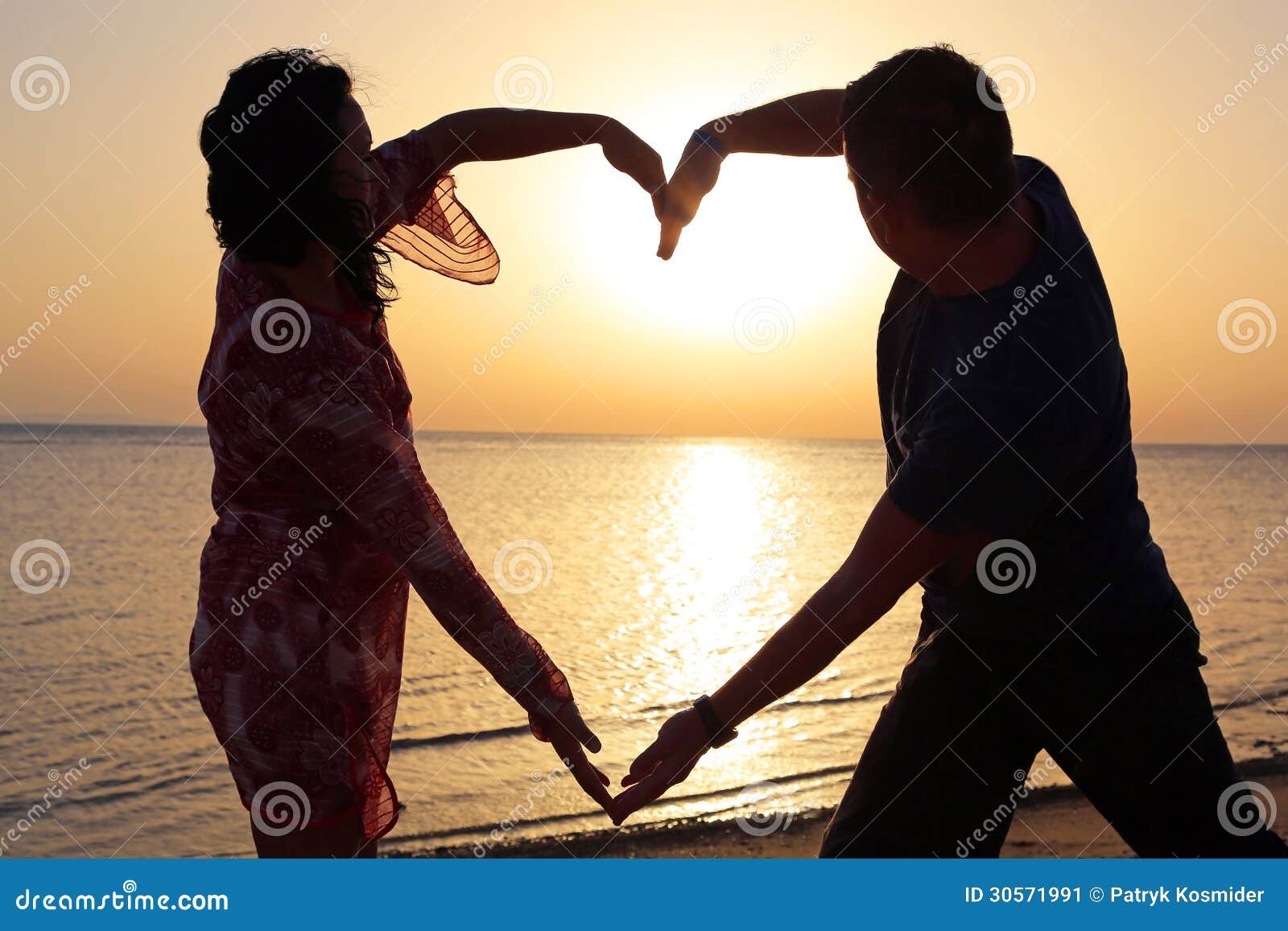 Couple Making Romantic Heart Shape at Sunrise Stock Image - Image of ...