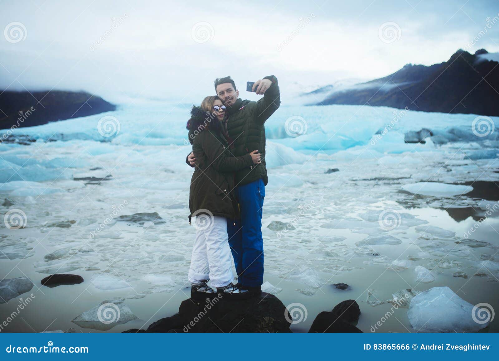 Couple Making Selfie on Stone at Lake Stock Photo - Image of selfie ...
