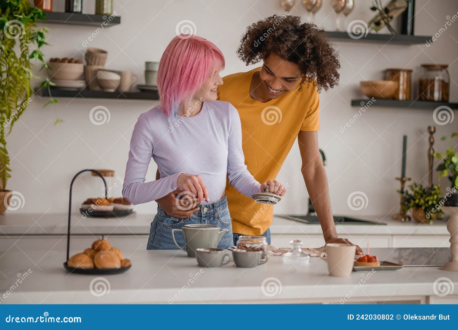 A Couple Making Tea in the Kitchen Stock Photo - Image of domestic ...