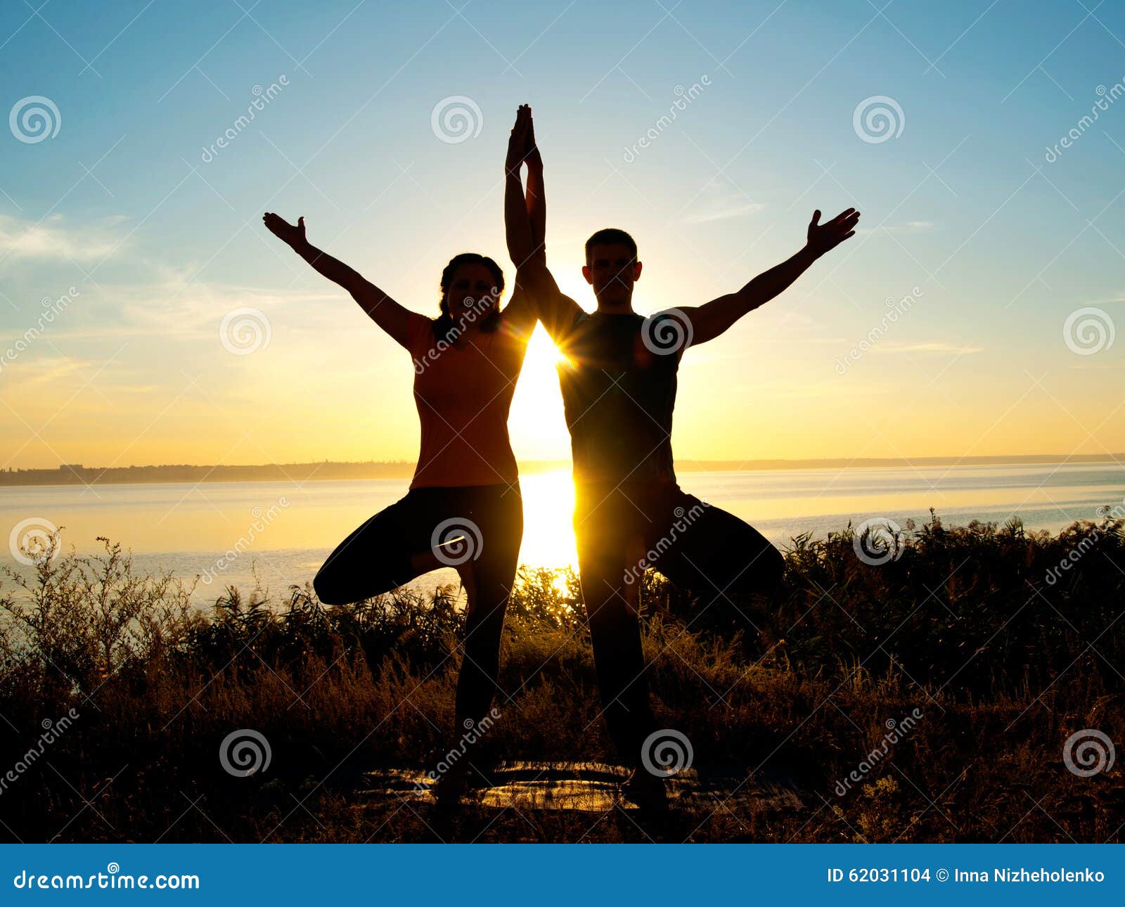 Couple Making Yoga Exercises Outdoors Stock Photo - Image of fitness ...