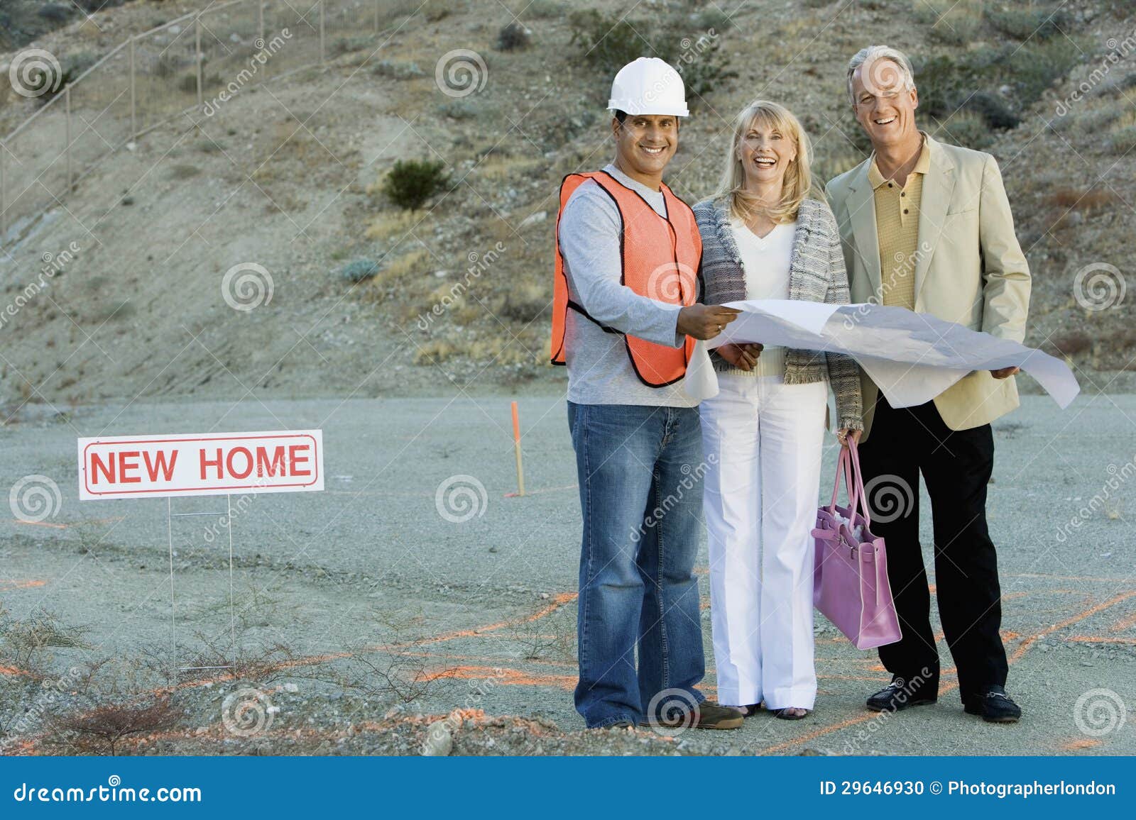 Couple with Male Foreman at Construction Site Stock Photo - Image of ...