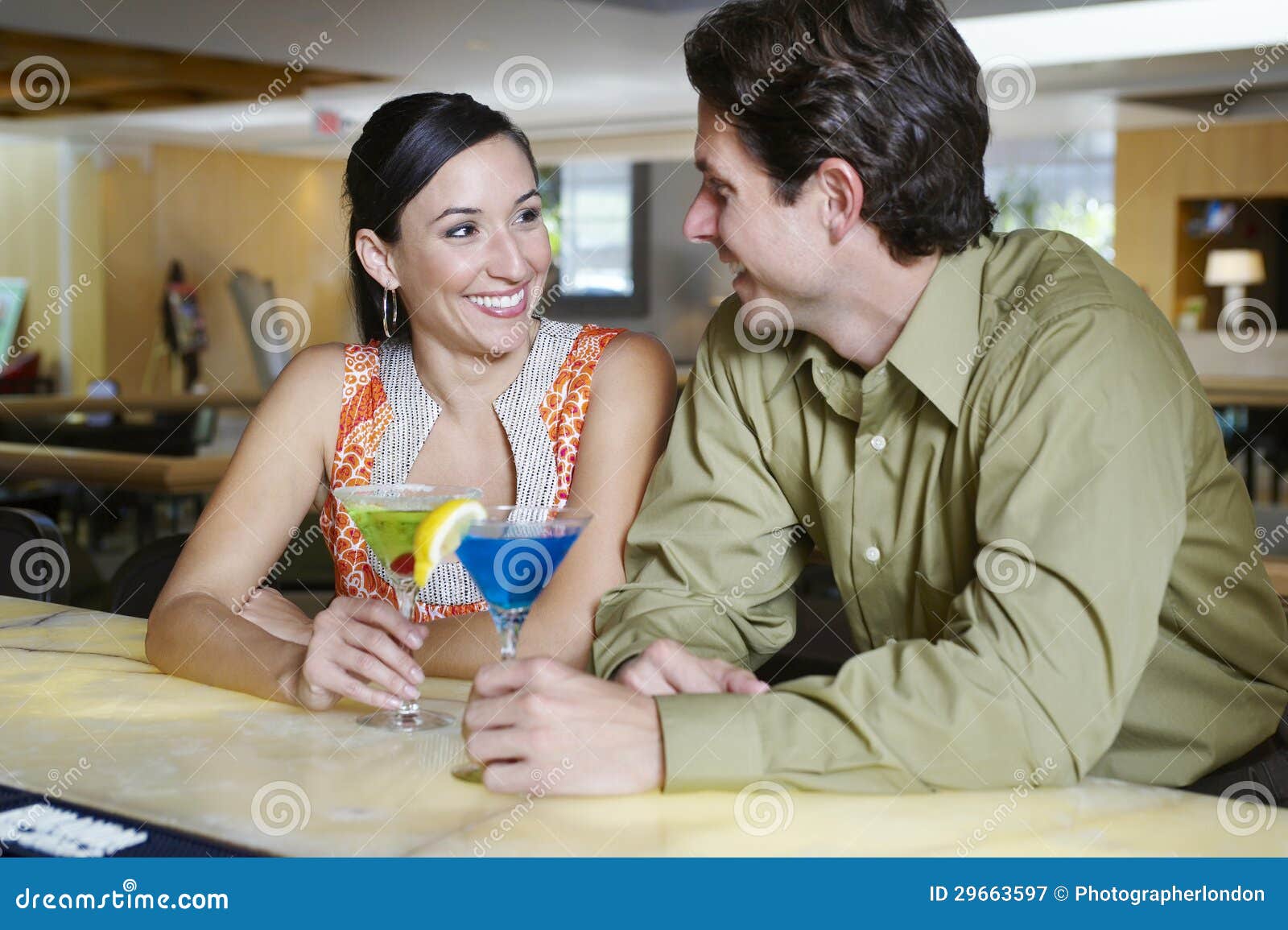 Couple with Martinis at Bar Counter Stock Image - Image of indoors ...