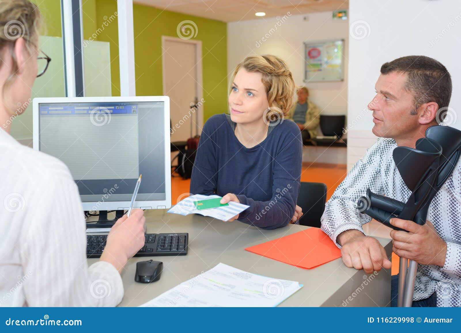 Couple with Medical Receptionist Stock Photo - Image of insurance ...