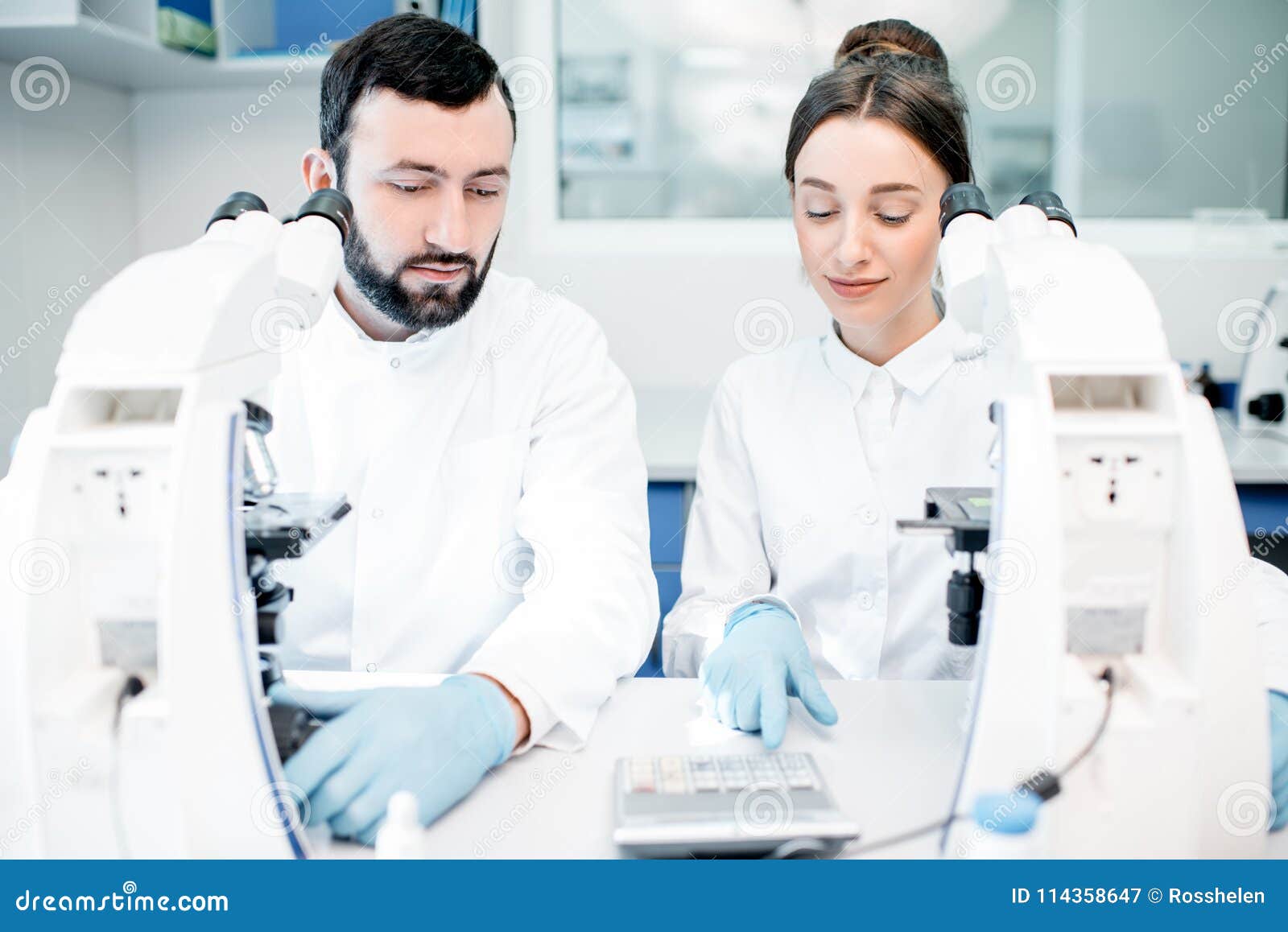 Medics Working with Microscope at the Laboratory Stock Image - Image of ...