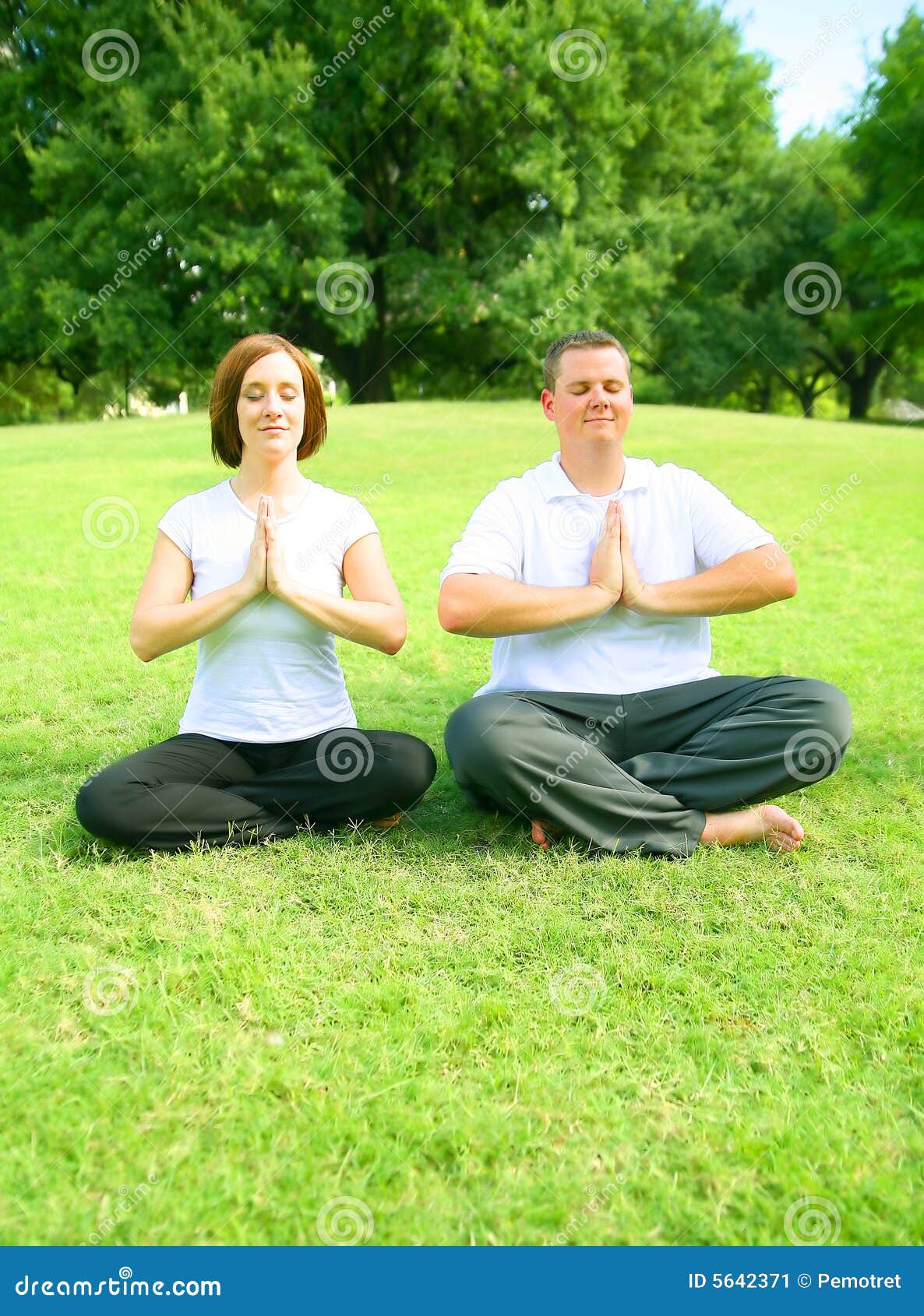 Couple Meditating in Park stock image. Image of happy - 5642371