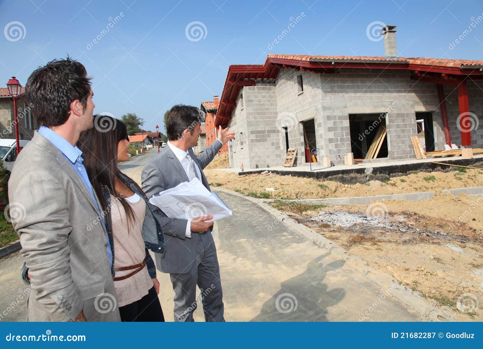 Couple Meeting Salesman on Construction Site Stock Image - Image of ...