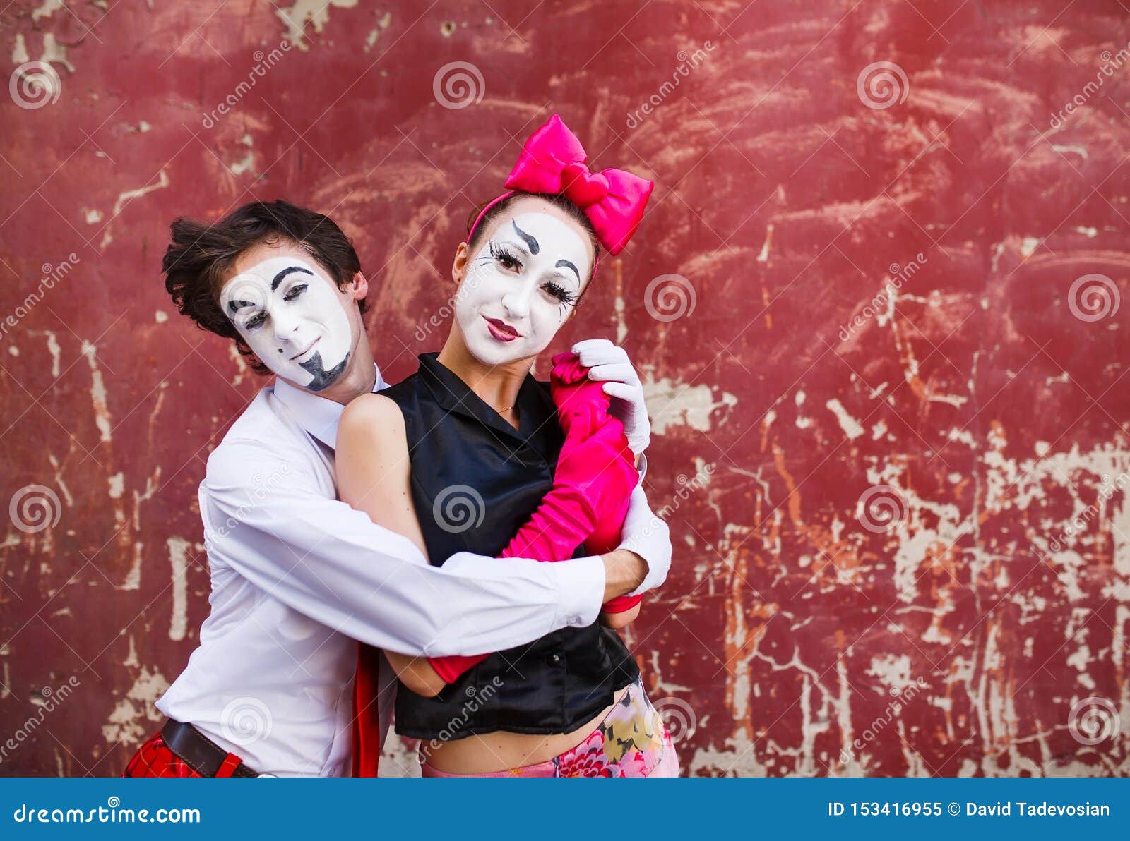 Couple Mimes Cute Pose in Front of a Red Wall Stock Image - Image of ...
