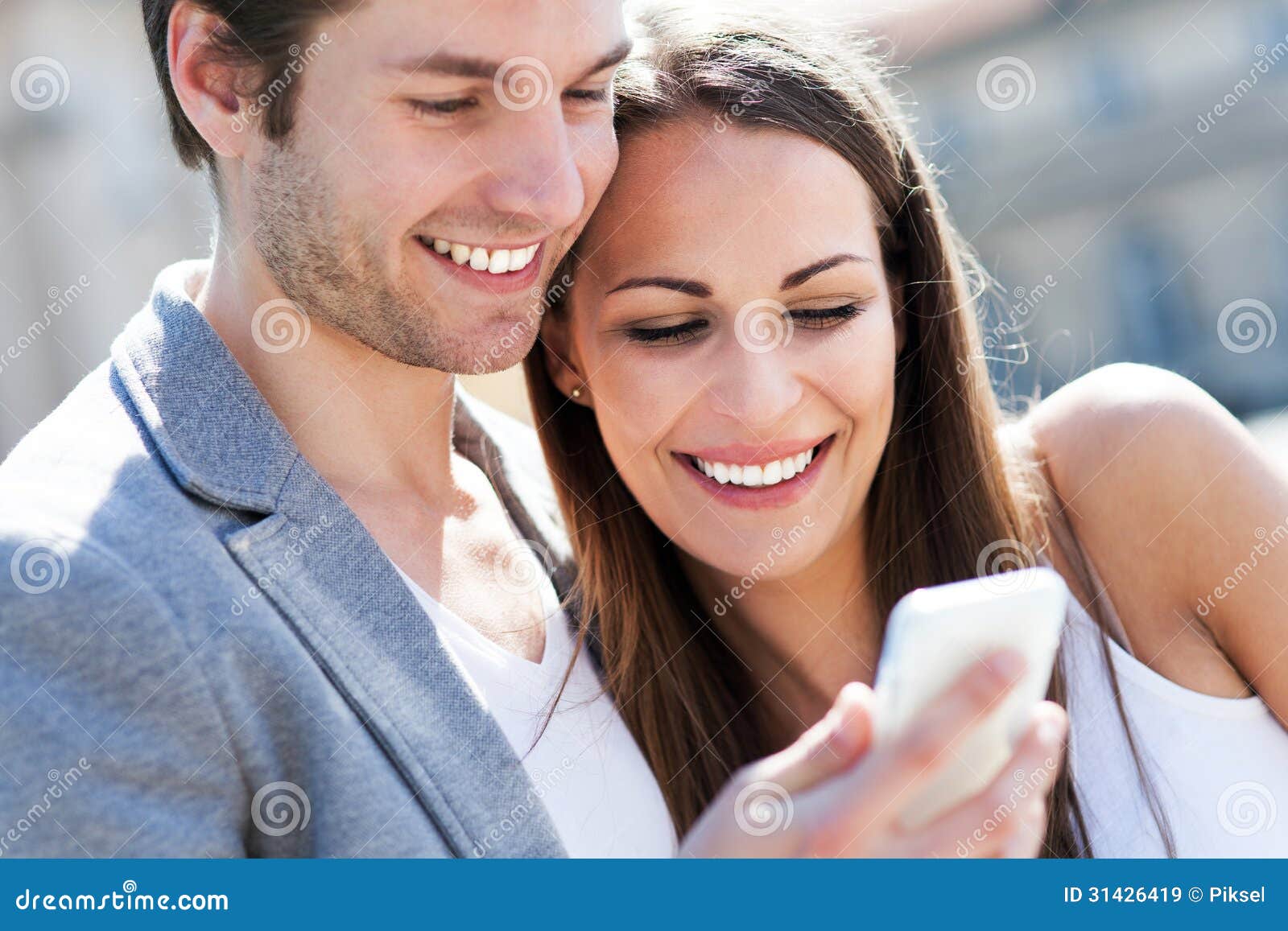 Couple with mobile phone stock image. Image of communication - 31426419
