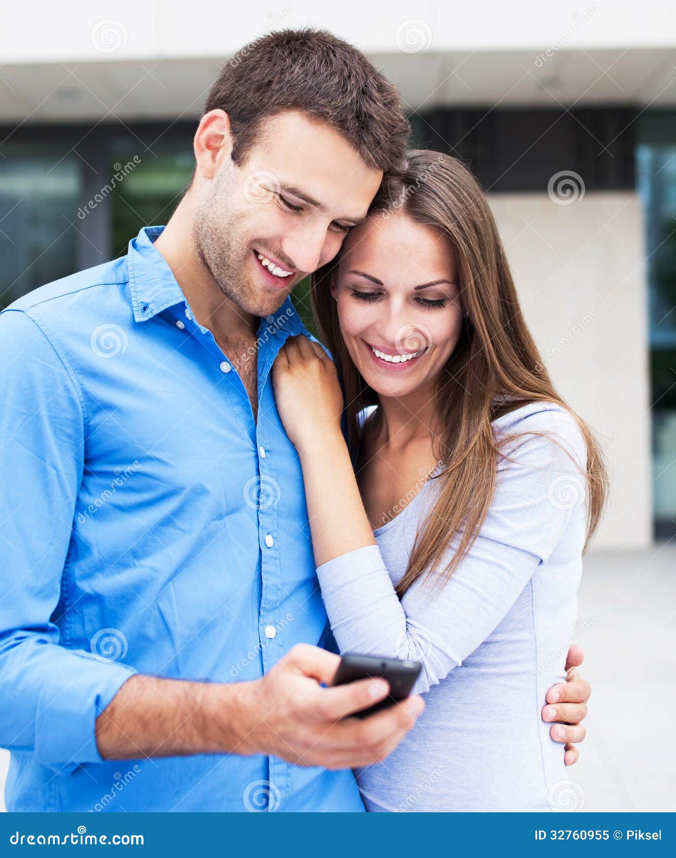Couple with mobile phone stock image. Image of carefree - 32760955