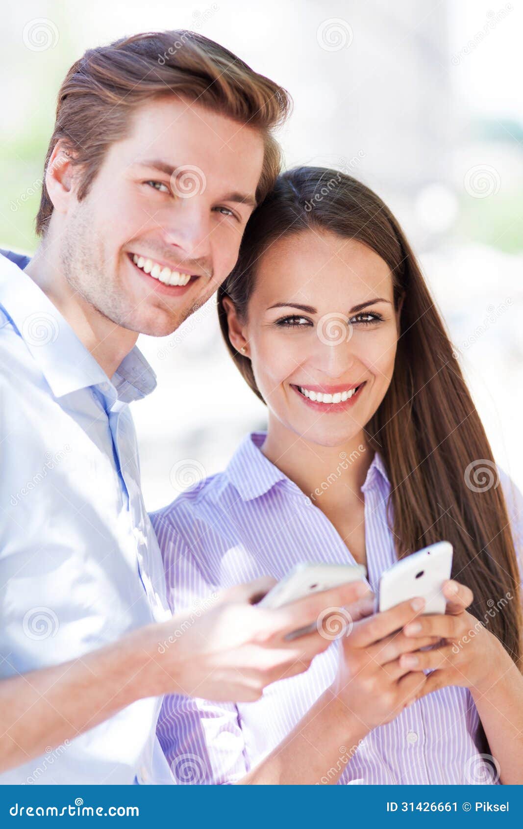 Couple with mobile phones stock image. Image of female - 31426661