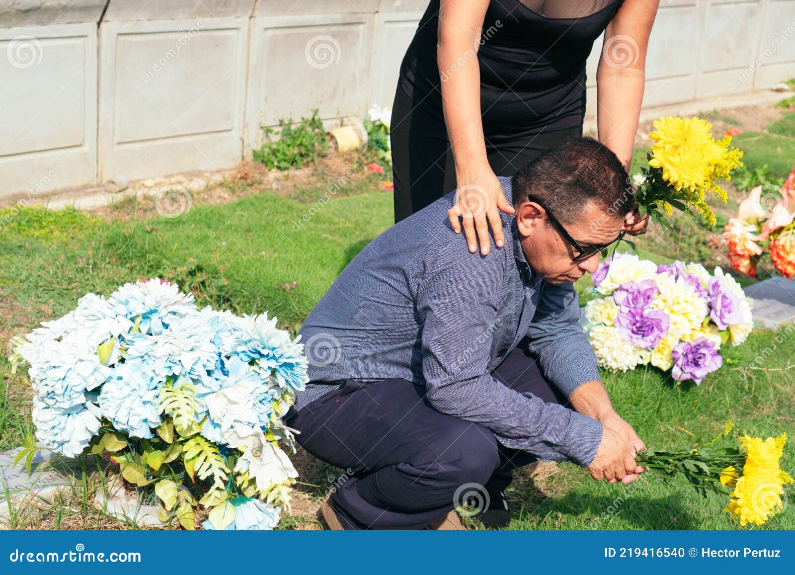 Couple Mourning Deceased Loved One At Cemetery Stock Photography ...
