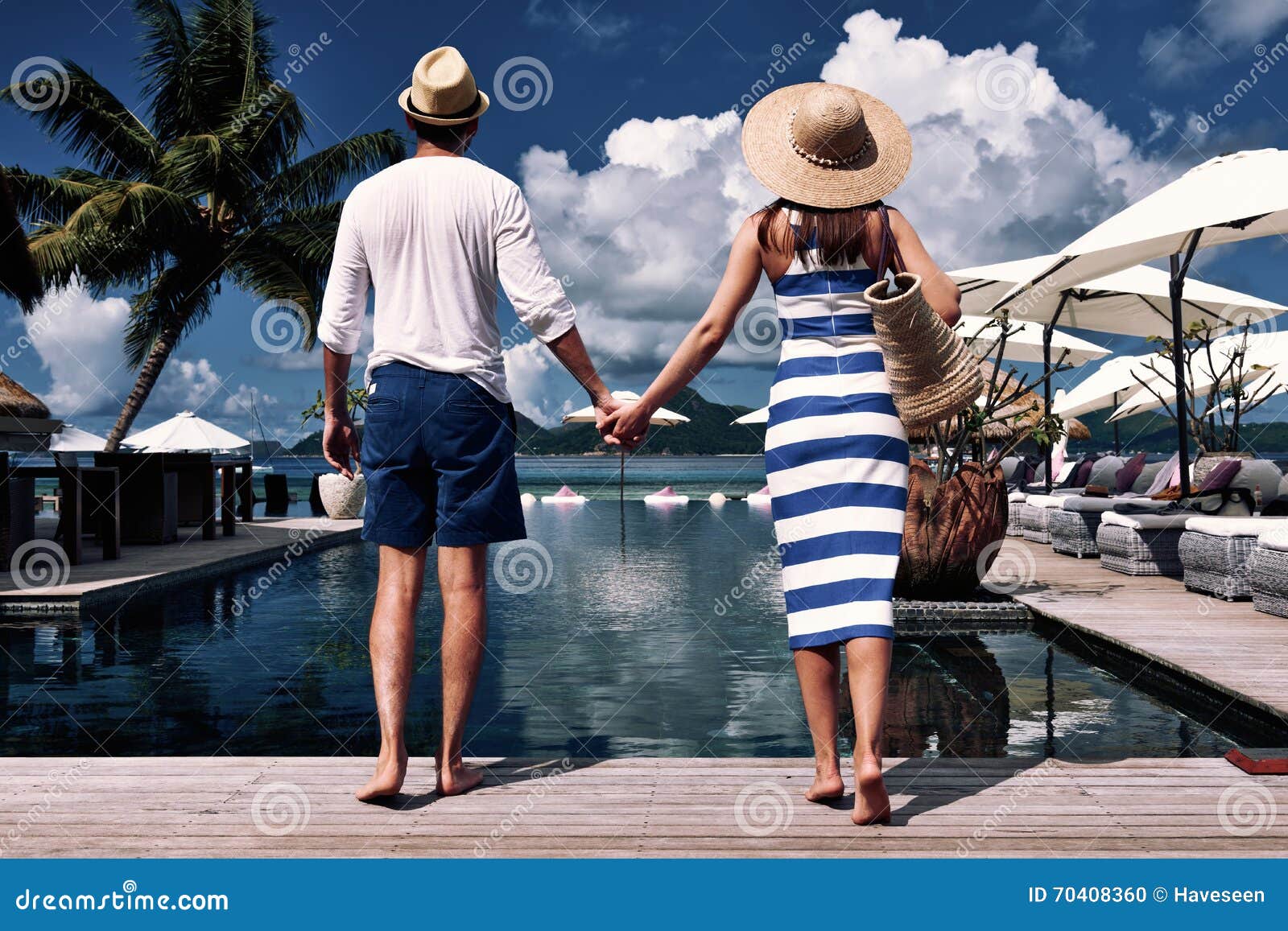 Couple near poolside stock photo. Image of casual, leisure - 70408360