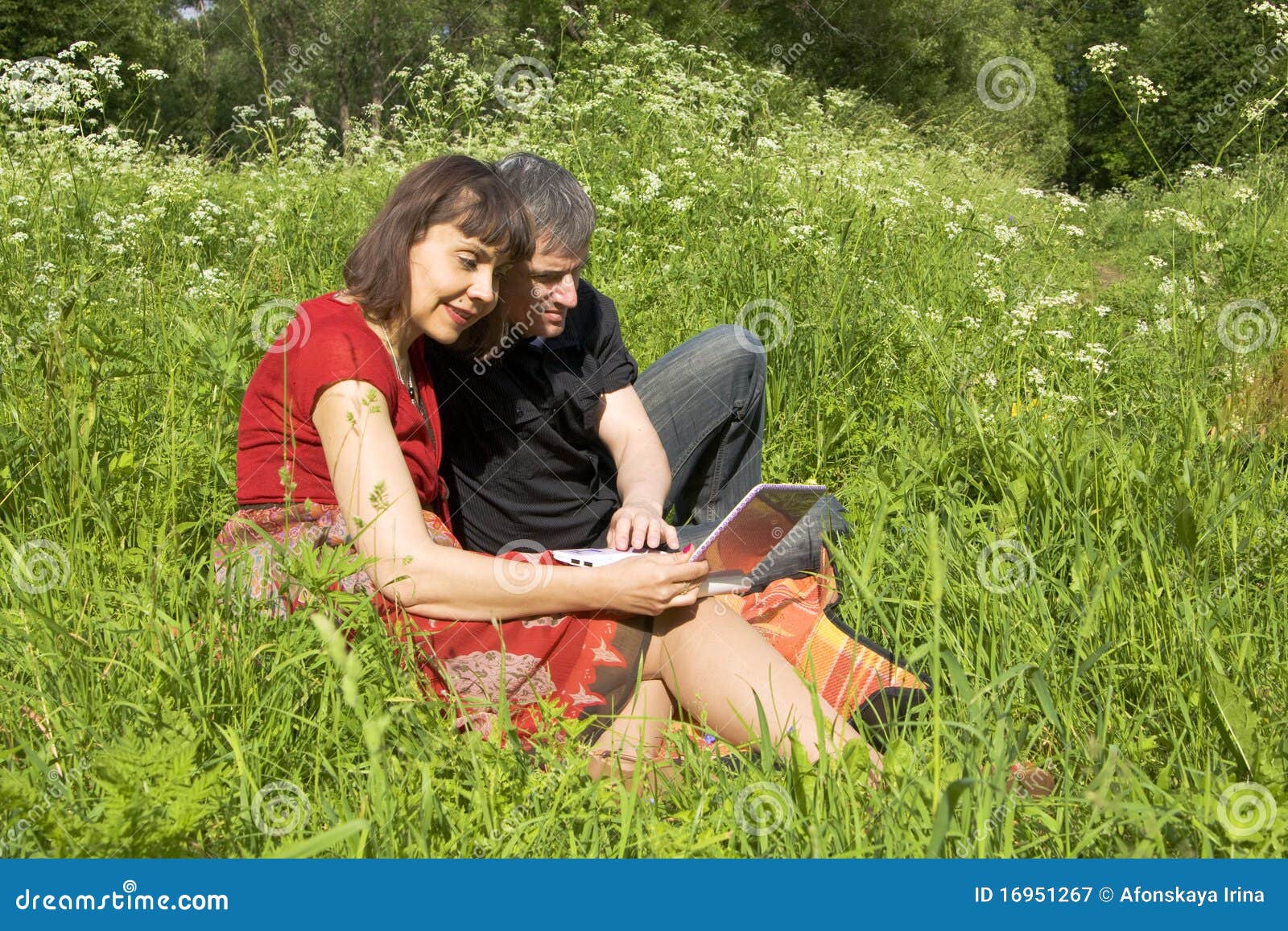Couple with notebook stock image. Image of meadow, woman - 16951267