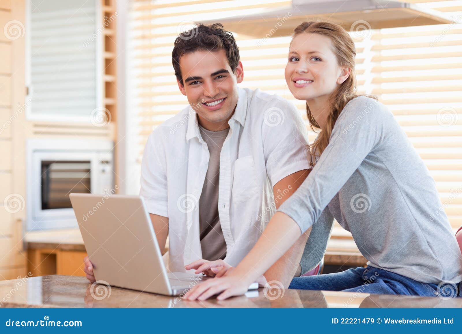 Couple with Notebook in the Kitchen Stock Image - Image of ...