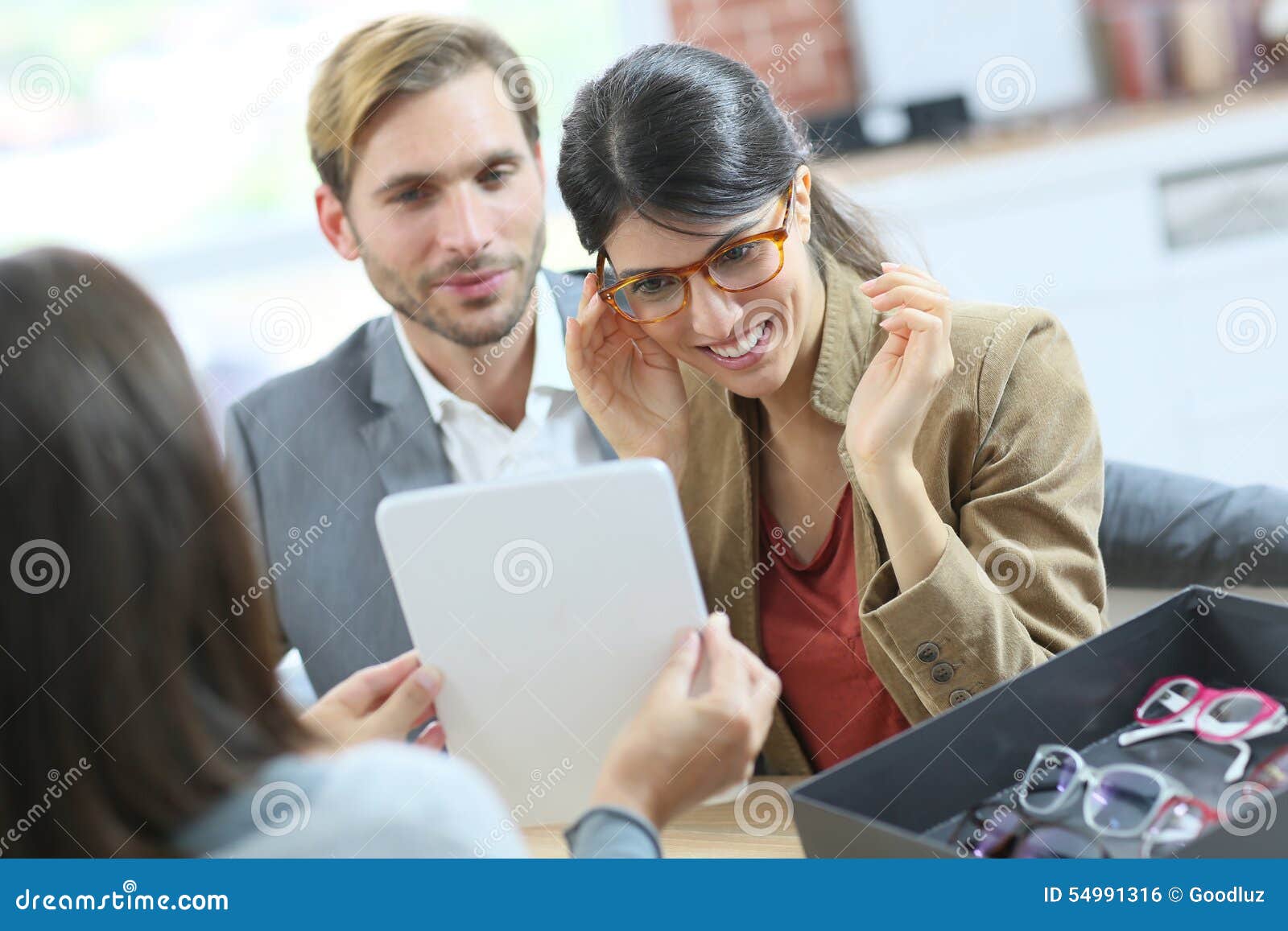 Couple In Optical Store Trying On Eyeglasses Stock Photography ...