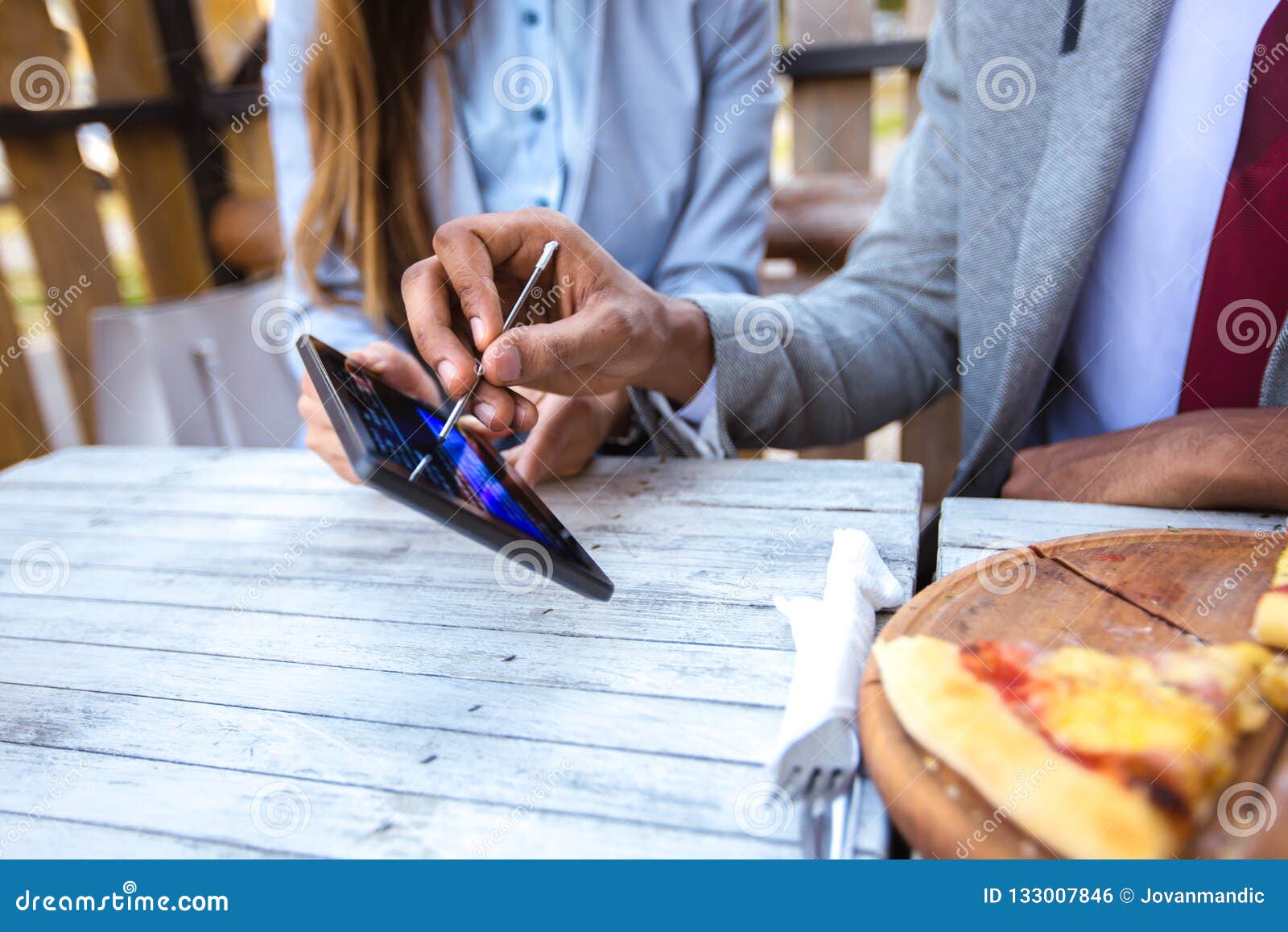 People Ordering Food on Tablet Computer in Restaurant Stock Photo ...