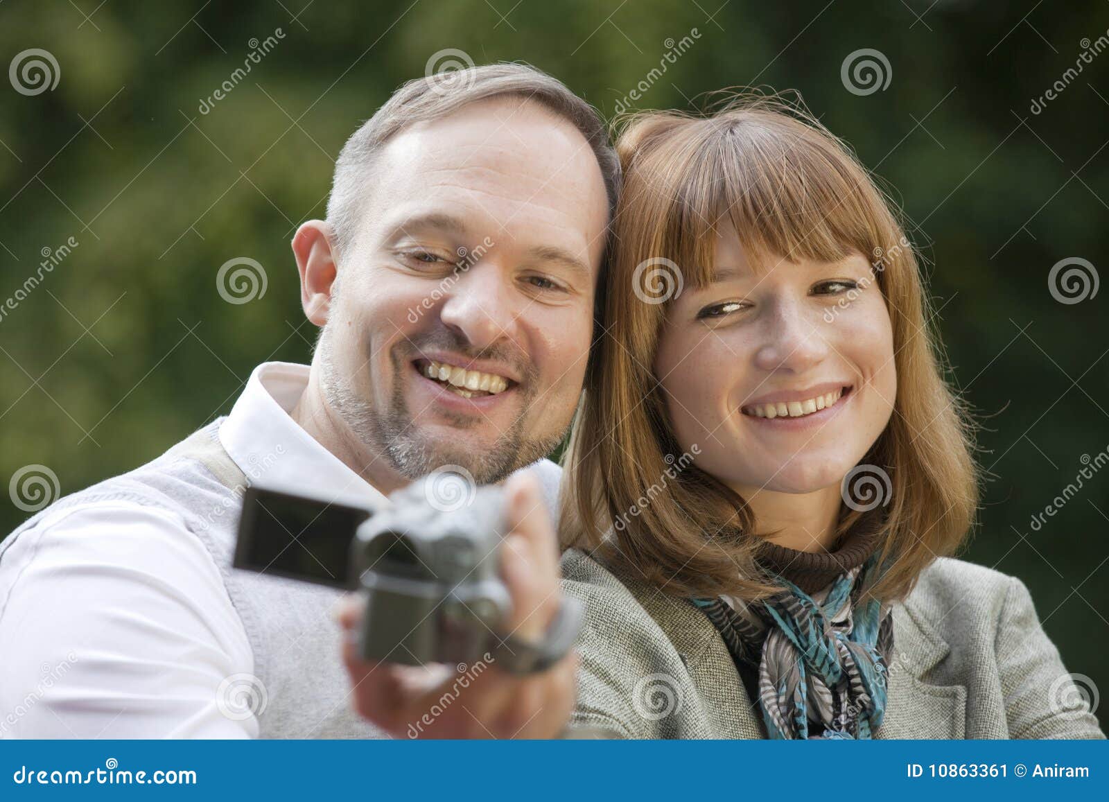 Couple Outdoor with Video Camera Stock Image - Image of smiling ...