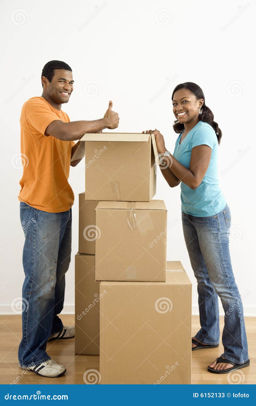 Couple packing boxes. stock image. Image of smiling, full - 6152133