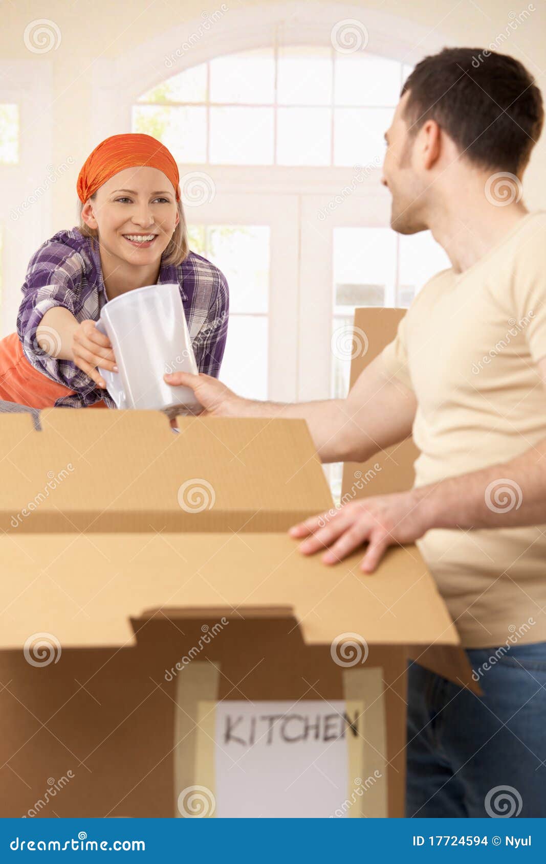 Couple Packing Kitchen Equipment Stock Photo - Image of clothing, cosy ...