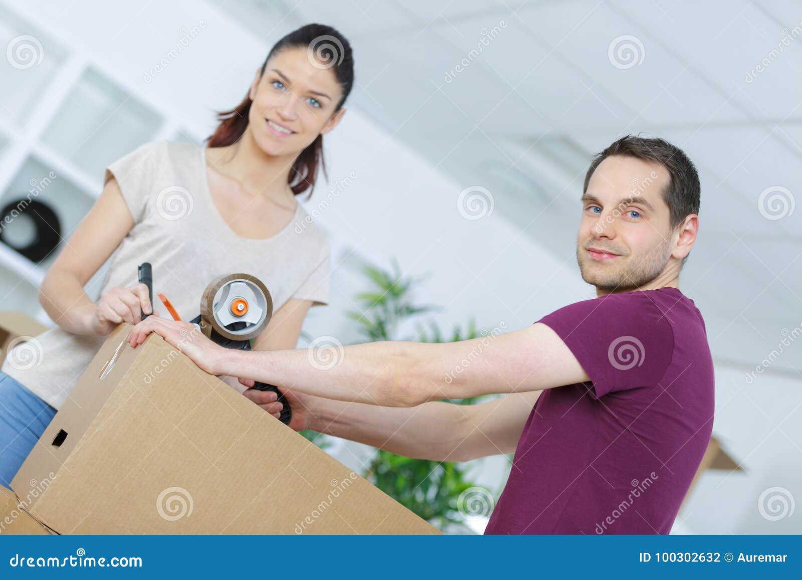 Couple Packing Stuff among Plenty Cardboard Boxes Stock Photo - Image ...