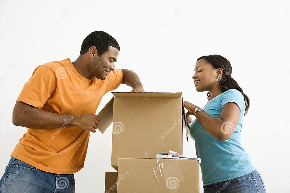 Couple packing together. stock photo. Image of beginnings - 6152152