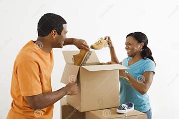 Couple packing together. stock photo. Image of african - 6152160